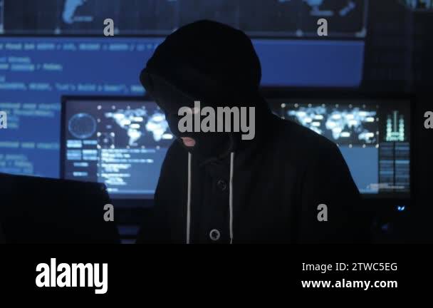 Dangerous Hacker In The Mask Tries To Enter The System Using Codes And
