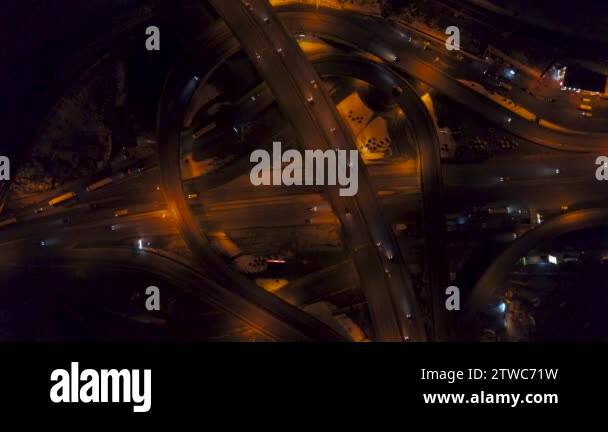 Vertical top down aerial view of traffic on freeway interchange at ...