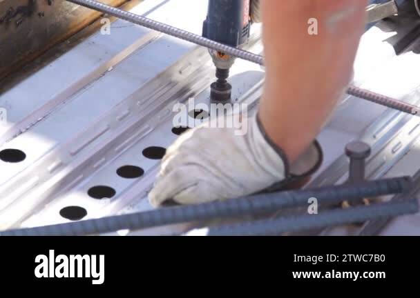 Man drilling holes in metal sheet Stock Video Footage - Alamy