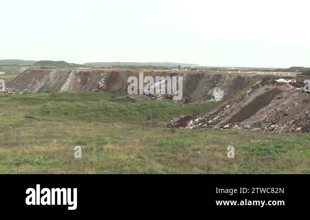 Truck with a trailer draped waste from the construction of brick ...