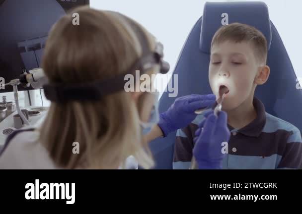 Doctor examine patient throat with ENT telescope and look inside the ...