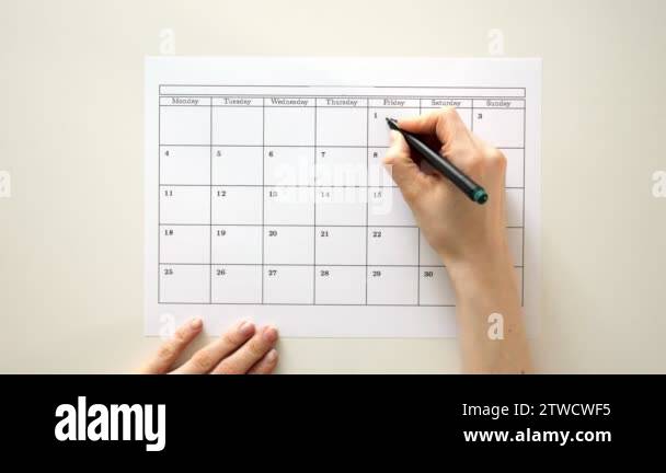 Sign the day in the calendar with a pen, draw a good bad day Stock ...