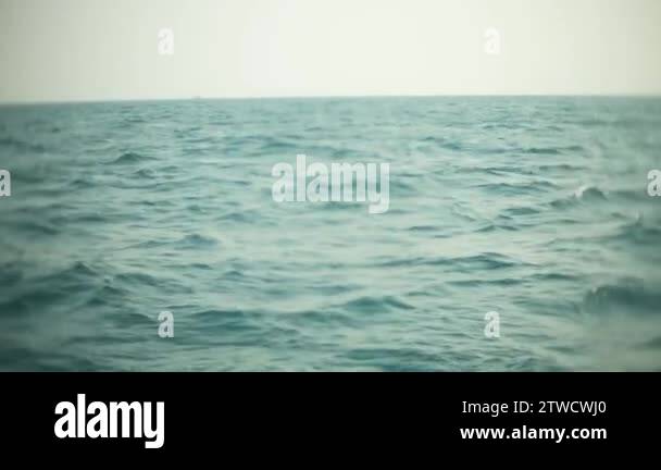 engine propellers churn the water in waves and wakes. The spray of ...