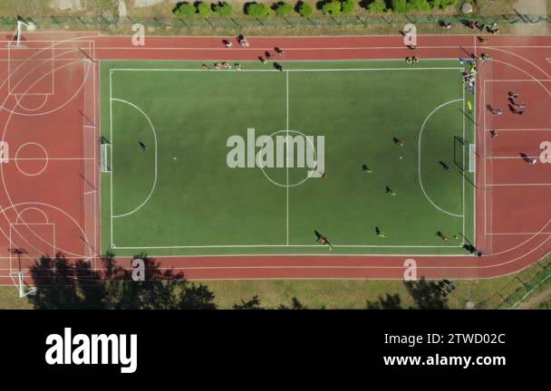 Aerial football match. Two teams playing ball in football outdoors, top ...