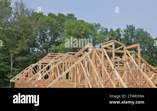 Timber frame house, stick built home under construction with wooden ...