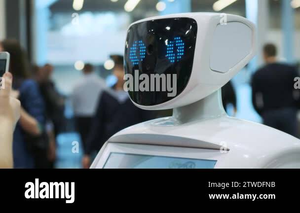 Modern Robotic Technologies. The robot looks at the camera at the ...