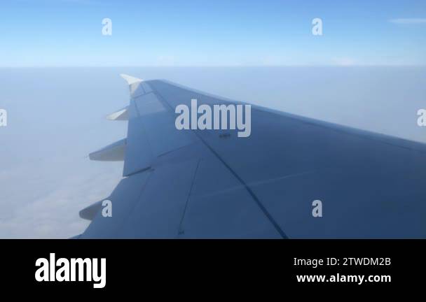 Wing of Wing of plane. A view of the sea and mountains from the plane ...