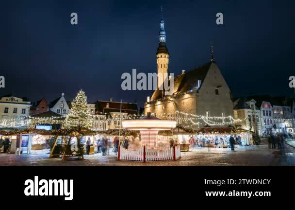 Tallinn, Estonia. Time-lapse Of Traditional Christmas Market And Carousel In Town Hall Square ...