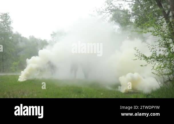 Combat squad of medieval knights of the Crusaders run through the smoke ...