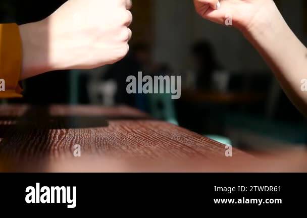 Rock paper scissors hand game. Two hands top aerial view. Tiled floor ...