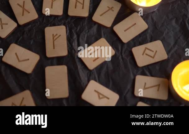 Wooden rune wheel. runic layout and candles, 4k, slow-motion shooting ...