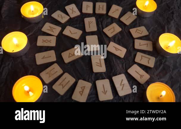 Wooden rune wheel. runic layout and candles, 4k, slow-motion shooting ...