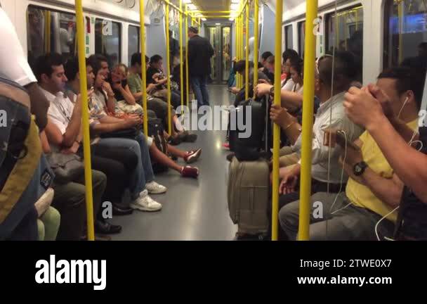 BANGKOK, THAILAND - NOVEMBER 14, 2015: Travellers inside BTS Skytrain ...
