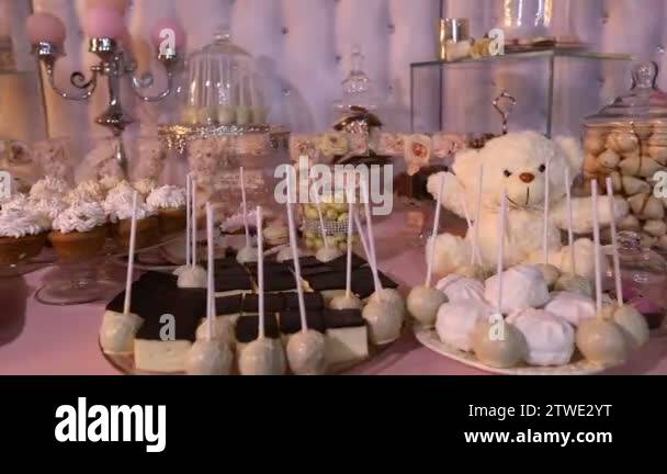 Candy bar in the restaurant, childrens party, a white teddy bear with a ...