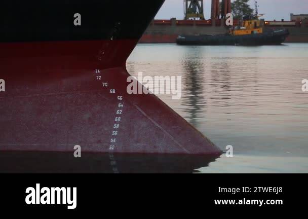 Panorama of submerged into the water freighter bow of ship under the ...