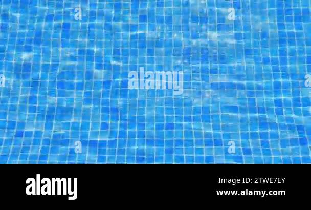 water ripples in swimming pool, blue tile background, 4k loop-ready ...