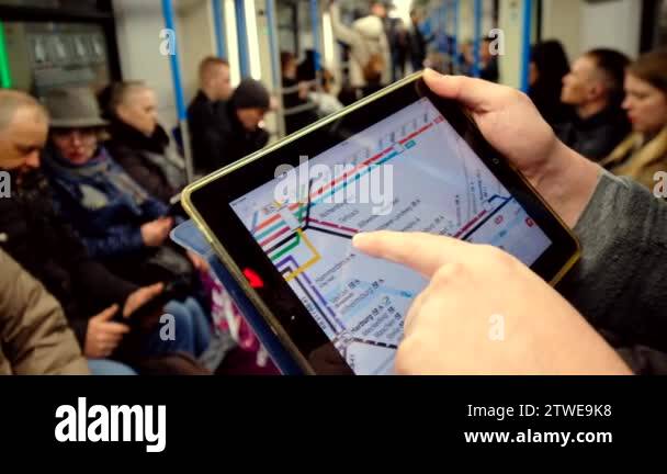 Man in underground examines the subway map using the tablet Stock Video ...