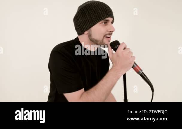 Frontman vocalist rock pop with a stylish beard in black clothes and a ...