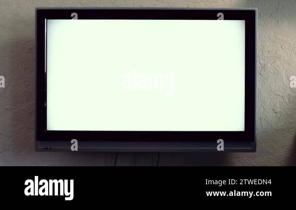 TV screen on wall. Led tv on the wall background with blank television screen. LCD or LED tv ...