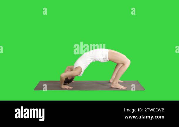 Sporty yoga girl performing Chakrasana Urdva Dhanurasana Wheel Pose on ...