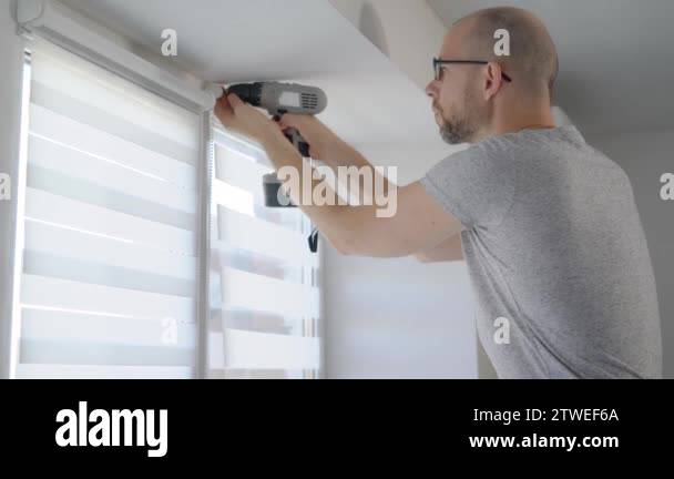Install blinds Stock Videos & Footage - HD and 4K Video Clips - Alamy