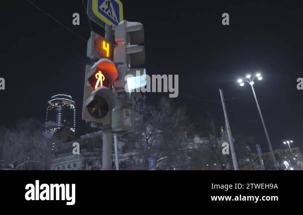 Glowing pedestrian traffic light. Action. Pedestrian traffic light ...