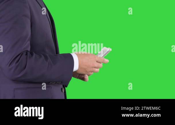 Businessman is counting money euros on a Green Screen, Chroma Key Stock ...