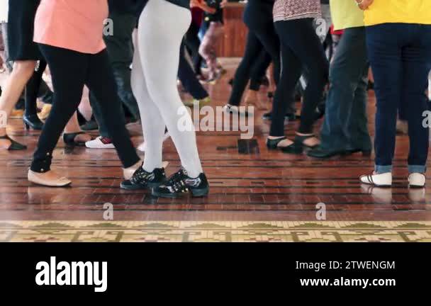 A lot of people training how to dance, they are dancing synchronized, in a ballroom. It's a ...