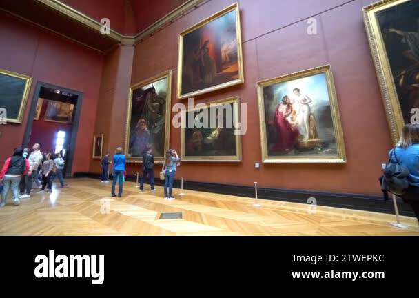 FRANCE, PARIS - circa JUN, 2017: Tourists visiting art gallery in Louvre Museum, one of largest ...