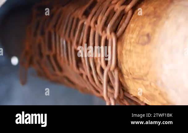 Vintage water well chain close up. Old rusty chain of the village well ...