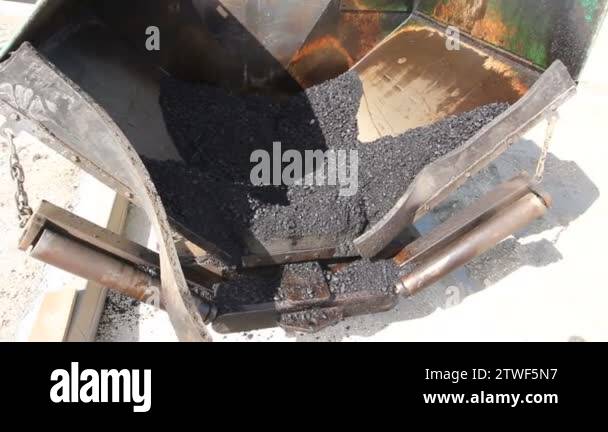 Tarmac road laying machine. Asphalt spreader.Front view on asphalt ...