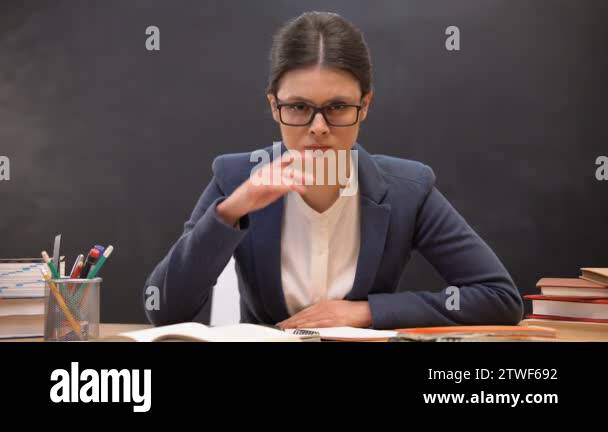 Strict looking teacher sitting Stock Videos & Footage - HD and 4K Video ...