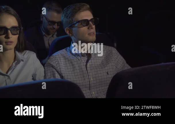 terrified man watches a horror film at the cinema Stock Video Footage ...