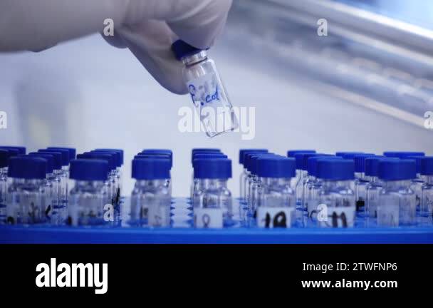 The scientist took out a small test tube with liquid from a laboratory ...