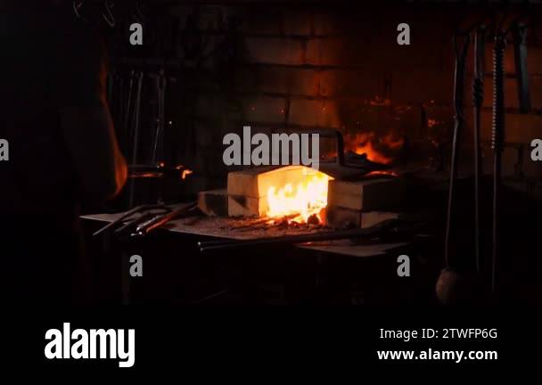 Hardening of the metal by sharp cooling in water. There is steam. The ...