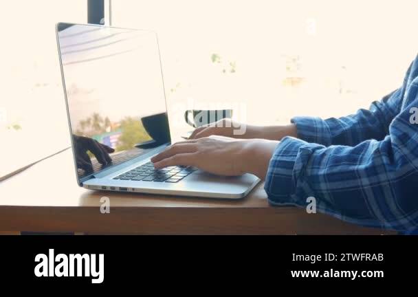 laptop keyboard typing. hands touch typing on a laptop keyboard with ...