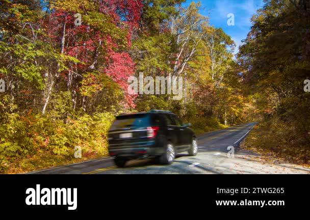 An SUV Driving Up the Scenic Highway 276 during Fall with Autumn Colors ...