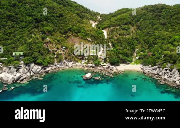 Calm sea near tropical volcanic island. Drone view of peaceful water of ...
