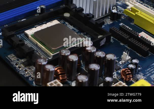 Technician remove CPU microprocessor from a motherboard socket. 4K ...