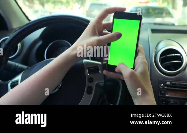 Girl Driver closeup, greenscreen in the car, urban city background ...