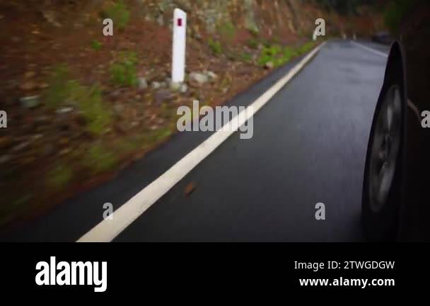 Driving a high-speed car along the markings on a cloudy day in the ...