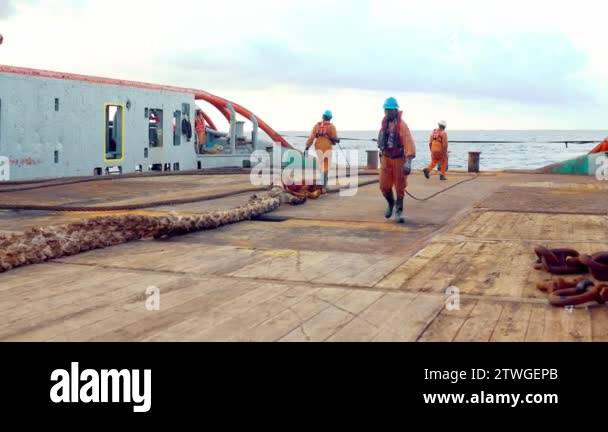 Anchor-handling Tug Supply AHTS vessel crew preparing vessel Stock Video Footage - Alamy