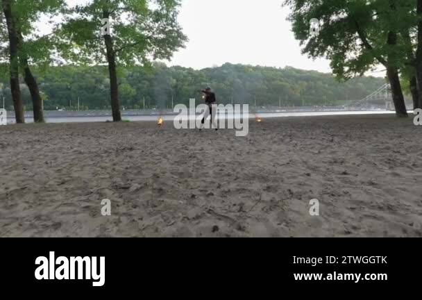 Confident slim woman dancing, performing a show with fireball standing ...