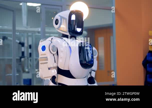 Robots head is getting turned around and back again with its hand being ...