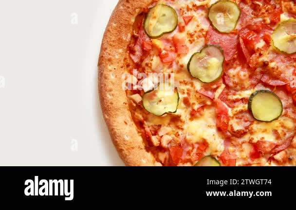 Delicious Italian pizza spinning on the white background. The footage ...