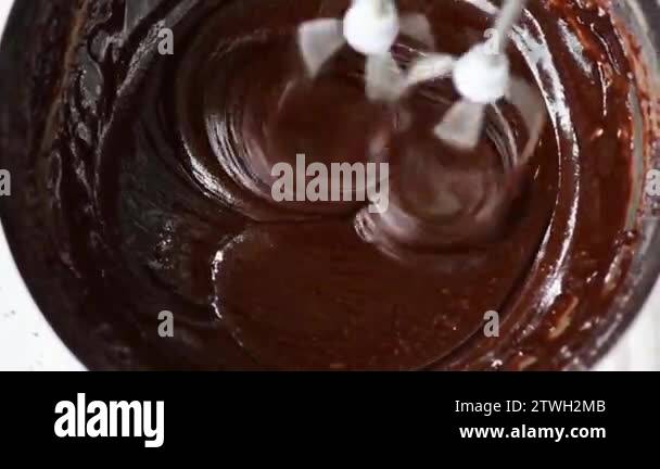 Mixing chocolate dough or batter for baking cakes, cookies, pastry ...