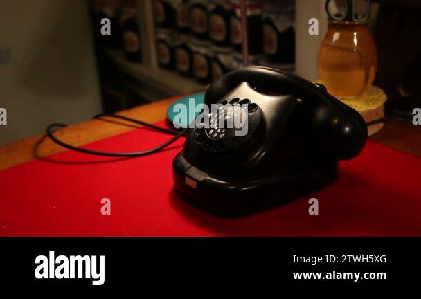 Dialing with an retro rotary phone, man in the office dials the old ...