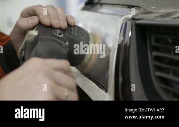 Close up for auto mechanic buffing and polishing car head. light. Art ...