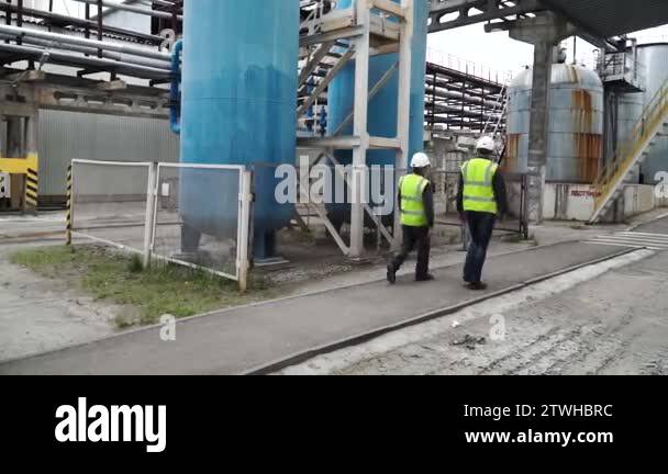 Back view of architects inspecting construction site. Clip. Rear view ...