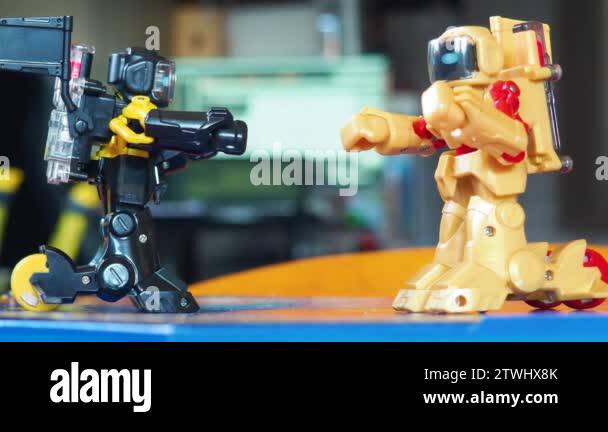 Toy Robots fighting on ring. Robot wars kids toys. Two transformer ...